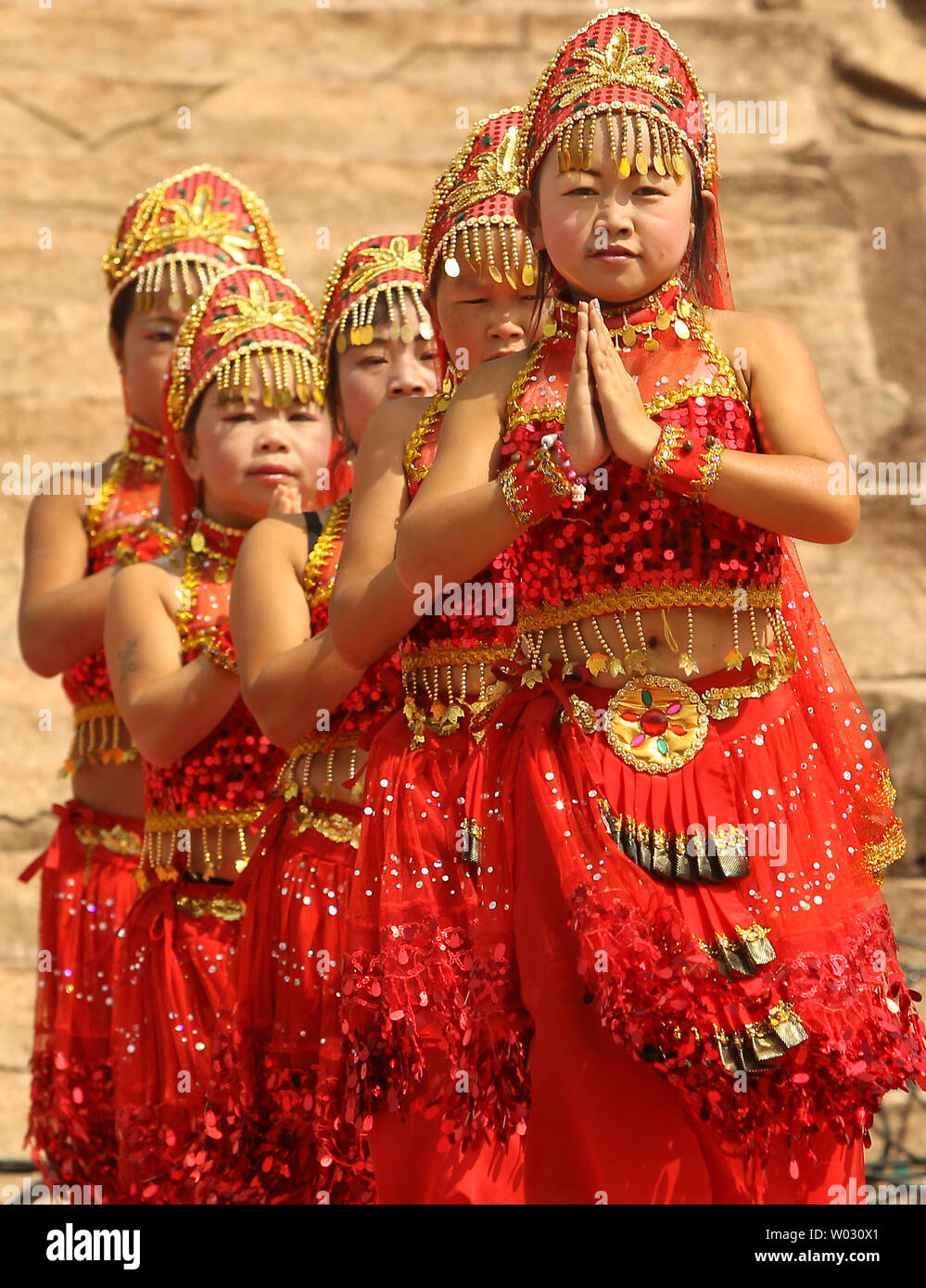 Female dwarves dance to a Moroccan tune during a twice-daily ...