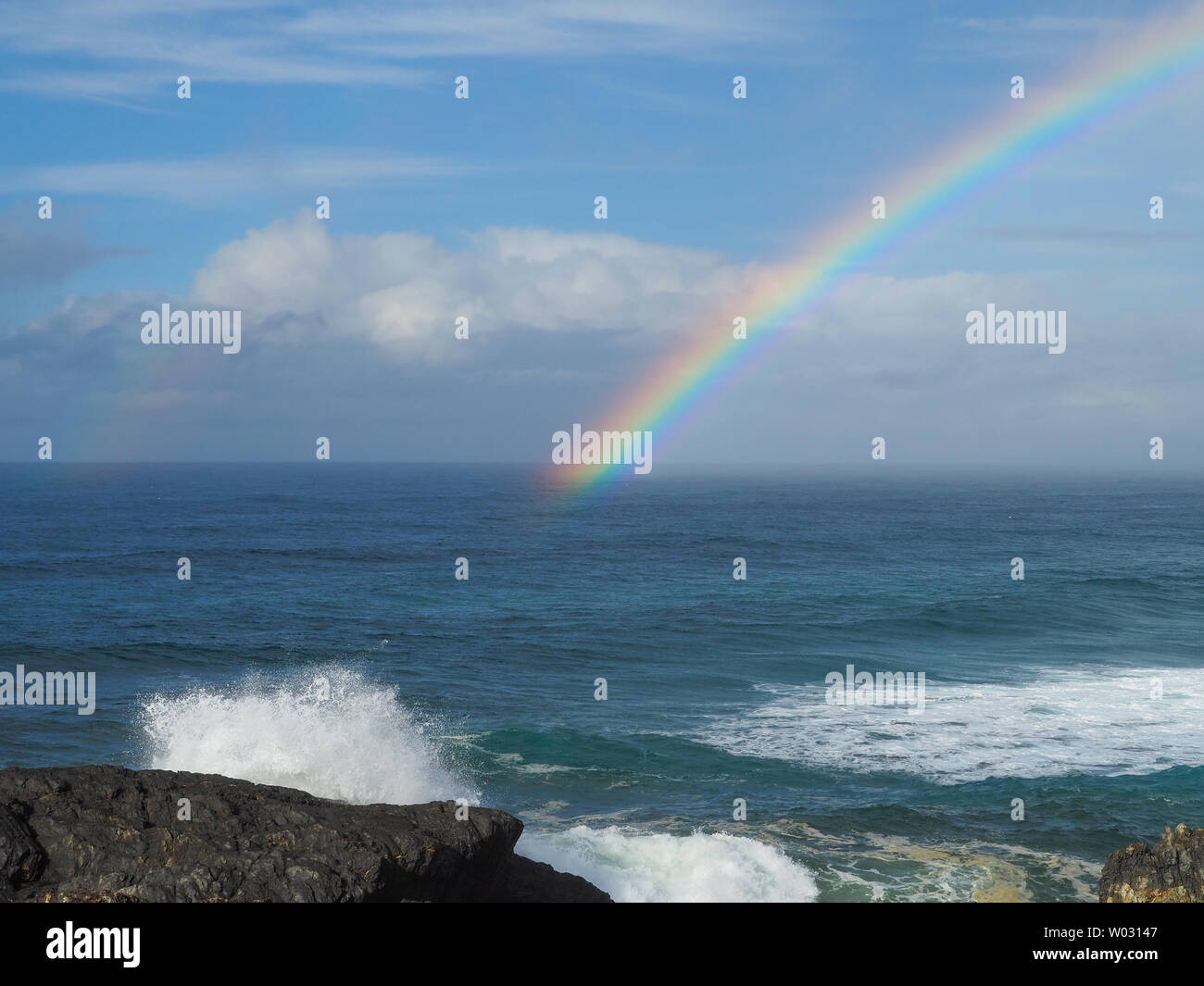 Beautiful Rainbow with a hint of a double over the ocean melding into ...