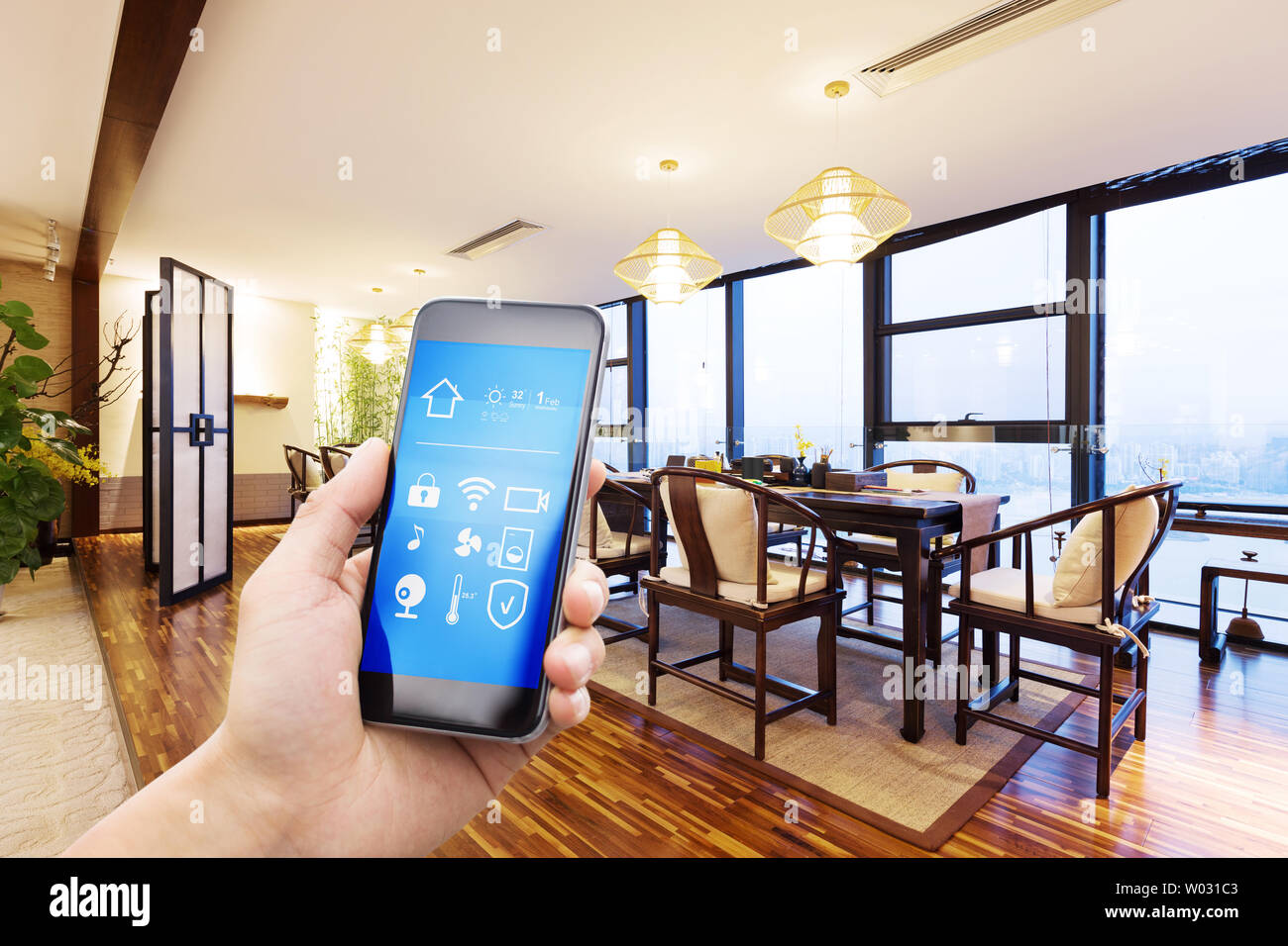 smart phone with smart home and modern dining room Stock Photo - Alamy