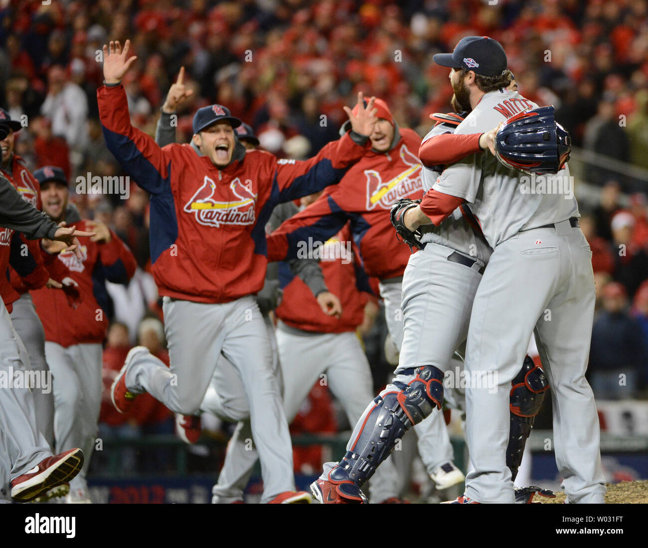 St. Louis Cardinals Jason Motte (R) is hugged by catcher Yadir Molina ...