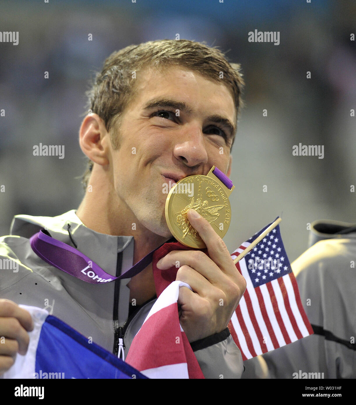 Michael Phelps of the United States kisses his Gold Medal for the Men's ...