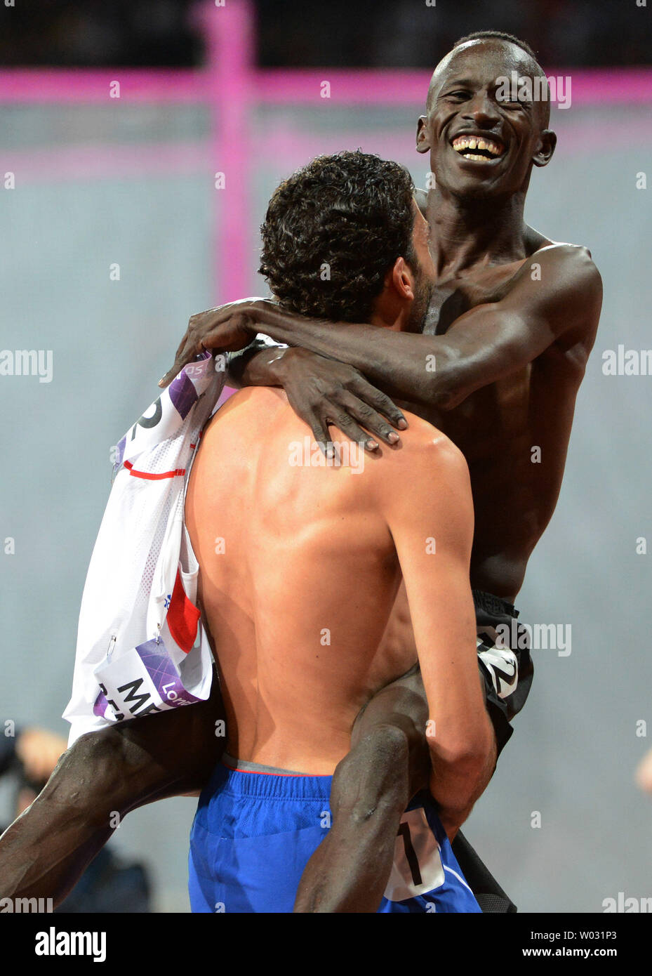 Gold medalist Kenya's Ezekiel Kemboi leaps into the arms of silver ...