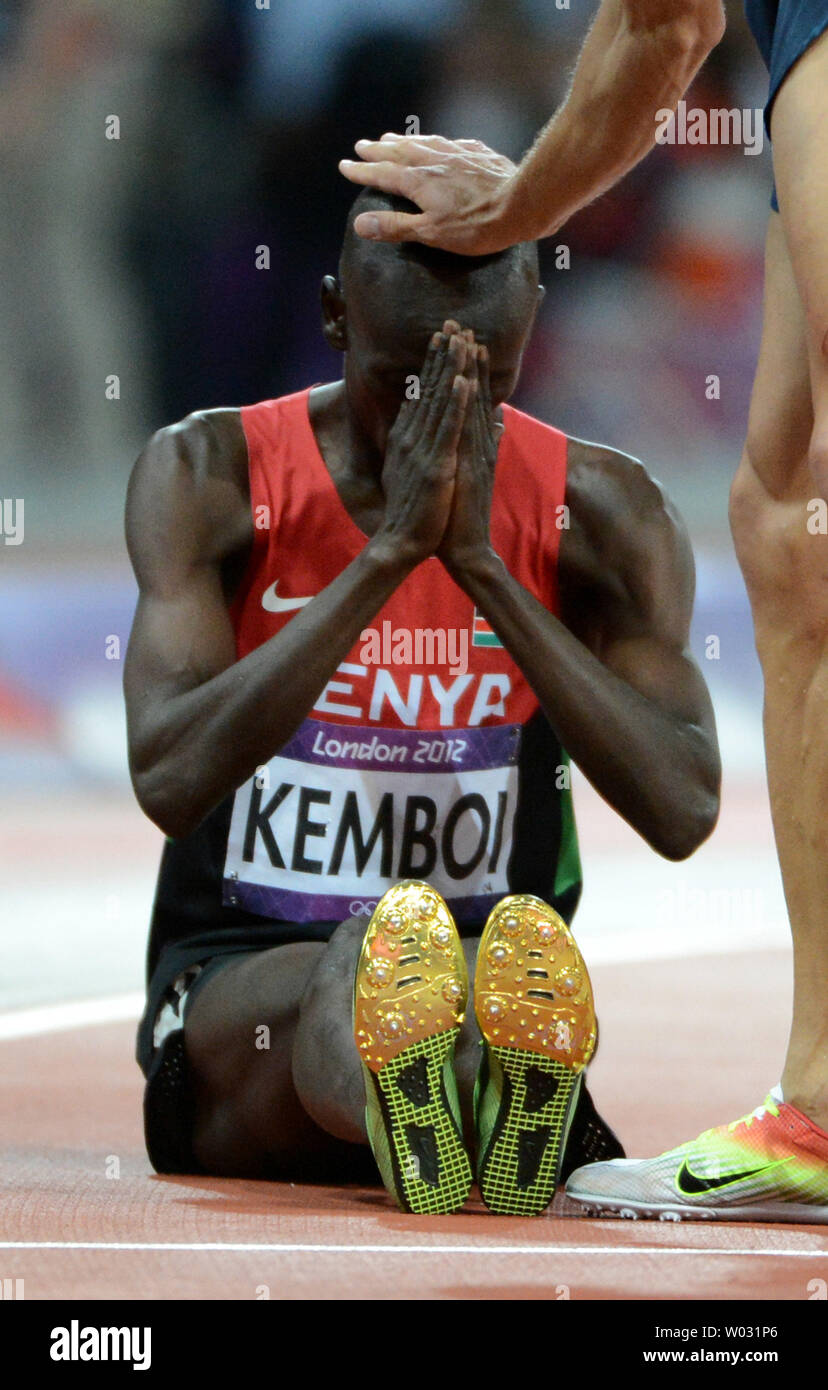 Gold medalist Kenya's Ezekiel Kemboi sits a prays after winning the Men ...