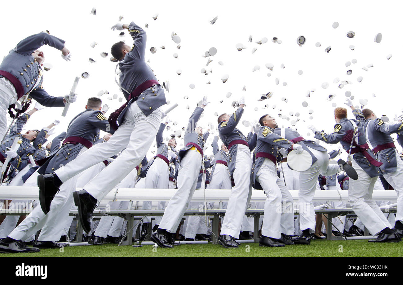 Cadets throw their caps at the end of the West Point graduation ...