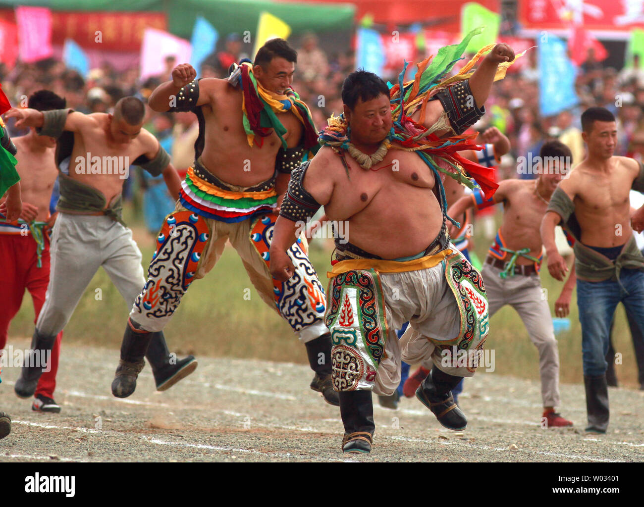 Mongolian wrestlers in traditional costume hi-res stock photography and ...