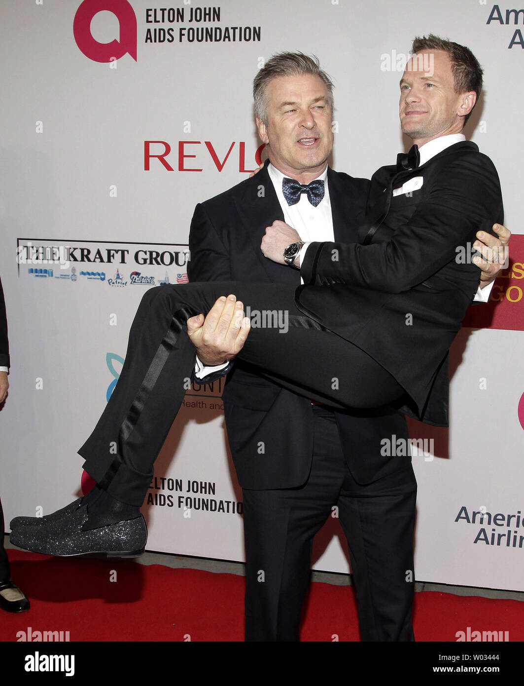 Alec Baldwin and Neil Patrick Harris arrive on the red carpet at the ...
