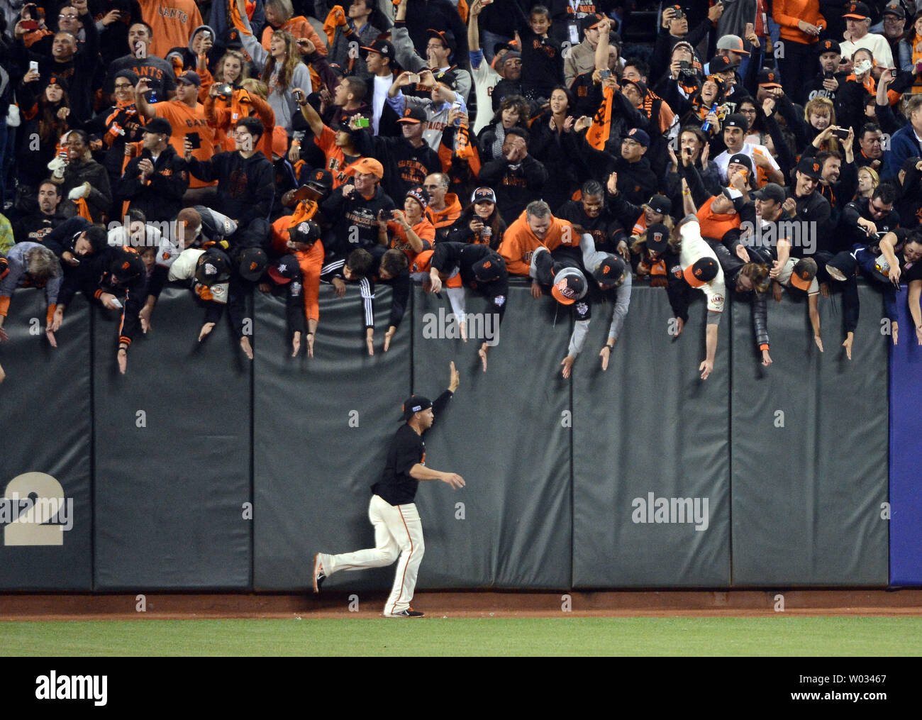 Fans of the San Francisco Giants celebrate the final out of Game 4 of ...