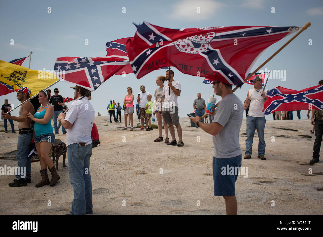 People participating in Confederate flag rally at the top of Stone ...