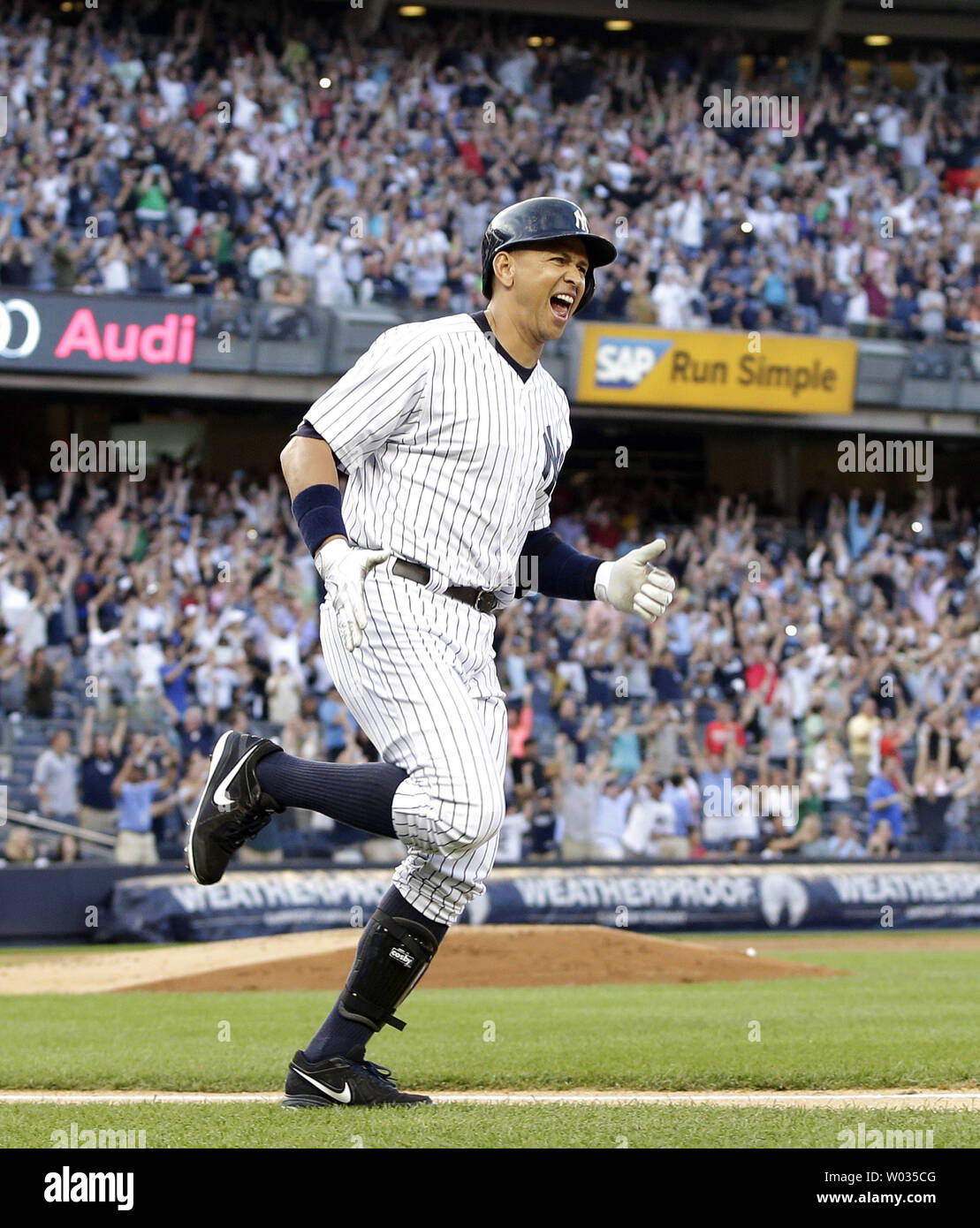 New York Yankees Alex Rodriguez celebrates running the bases after ...