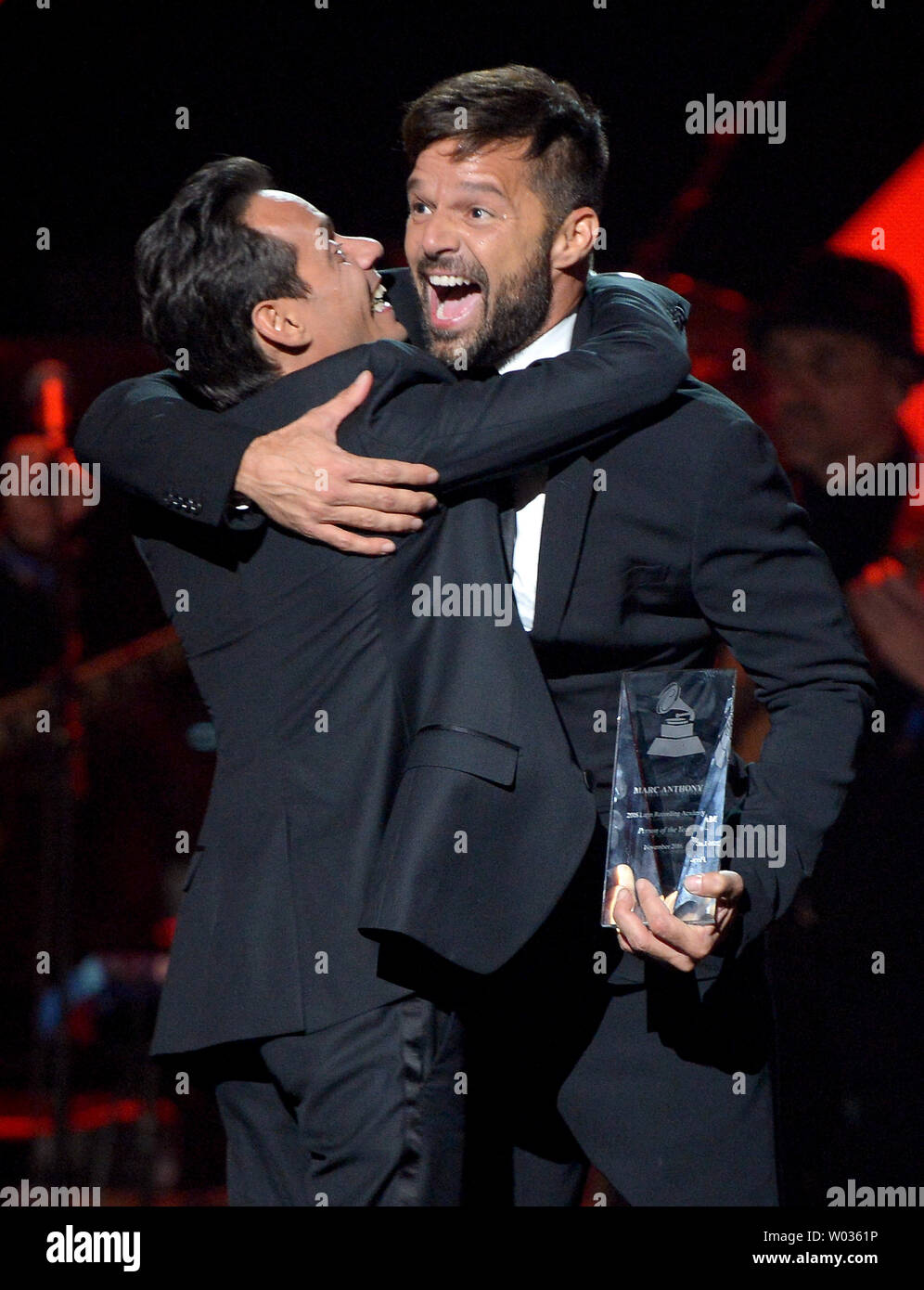 Recording artist Ricky Martin (R) presents honoree Marc Anthony with ...