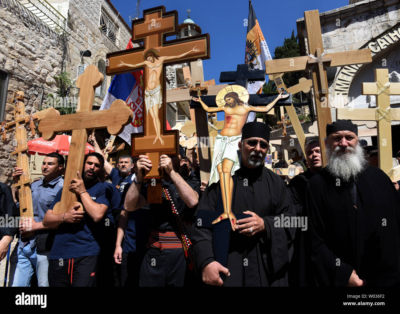 Orthodox Christian pilgrims carry crosses on the Via Dolorosa in the ...