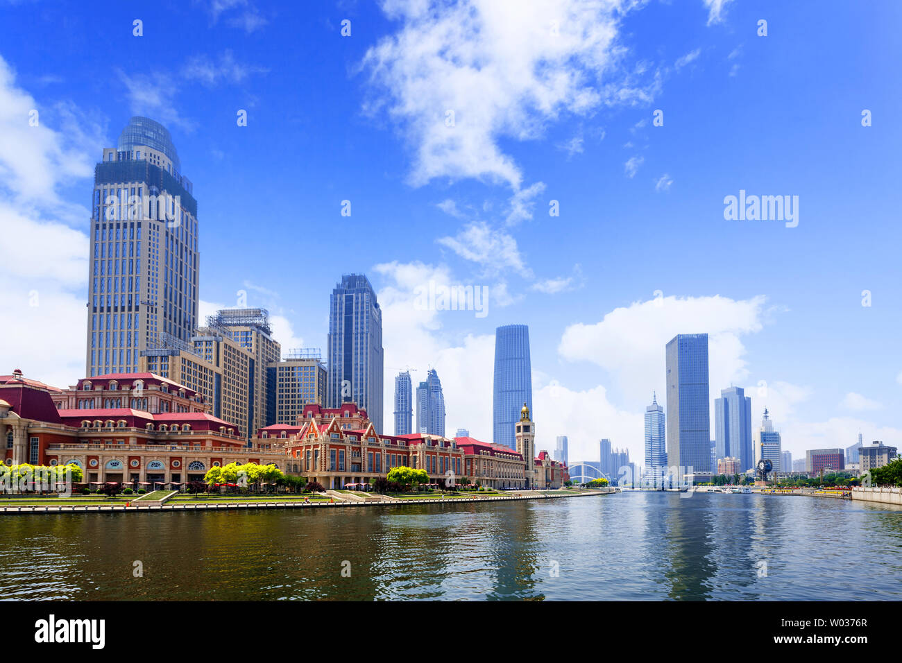 modern buildings in urban city at riverbank Stock Photo - Alamy