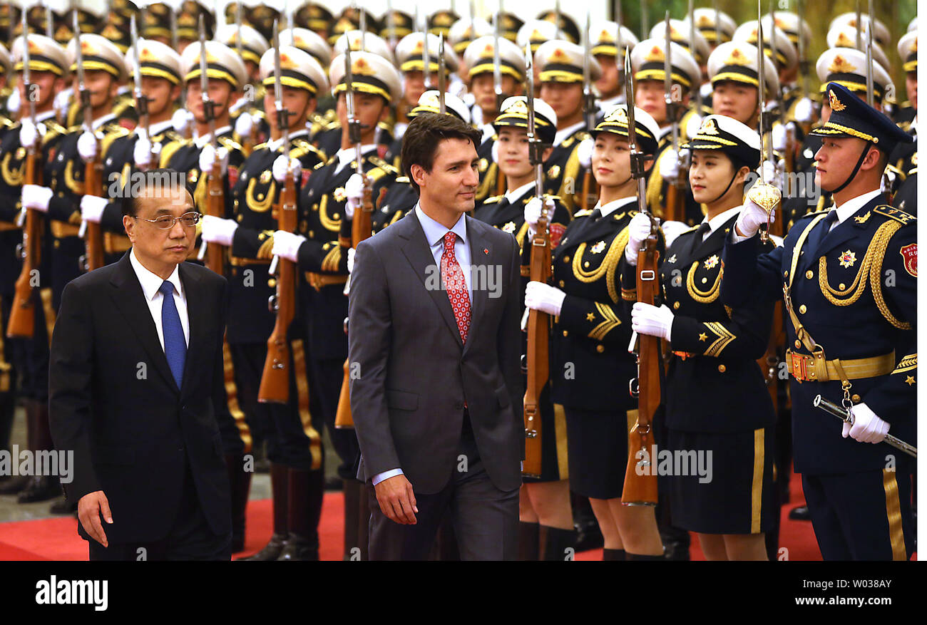 Canadian Prime Minister Justin Trudeau (R ) and Chinese Premier Li ...