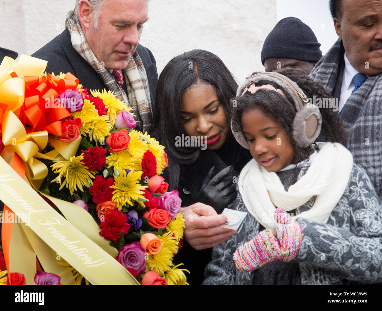 Interior Secretary Ryan Zinke gives a challenge coin to Yolanda King ...