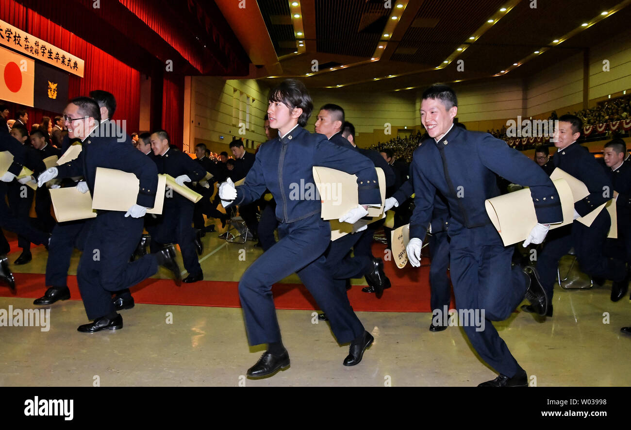 Graduates of Japan's National Defense Academy leave after the ...