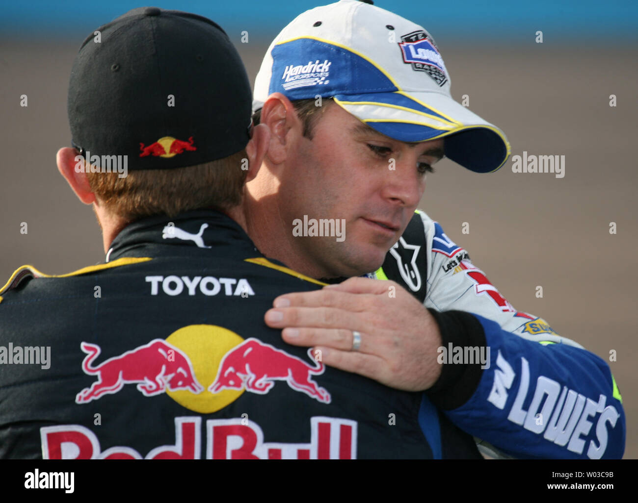 Jimmie Johnson (R) gives Brian Vickers a hug before their qualifying ...