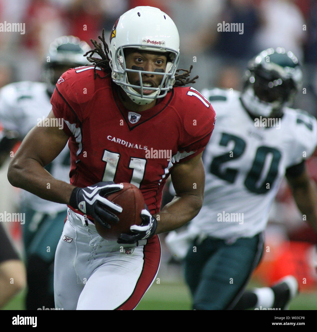 Arizona Cardinals wide receiver Larry Fitzgerald (L) heads to the end ...