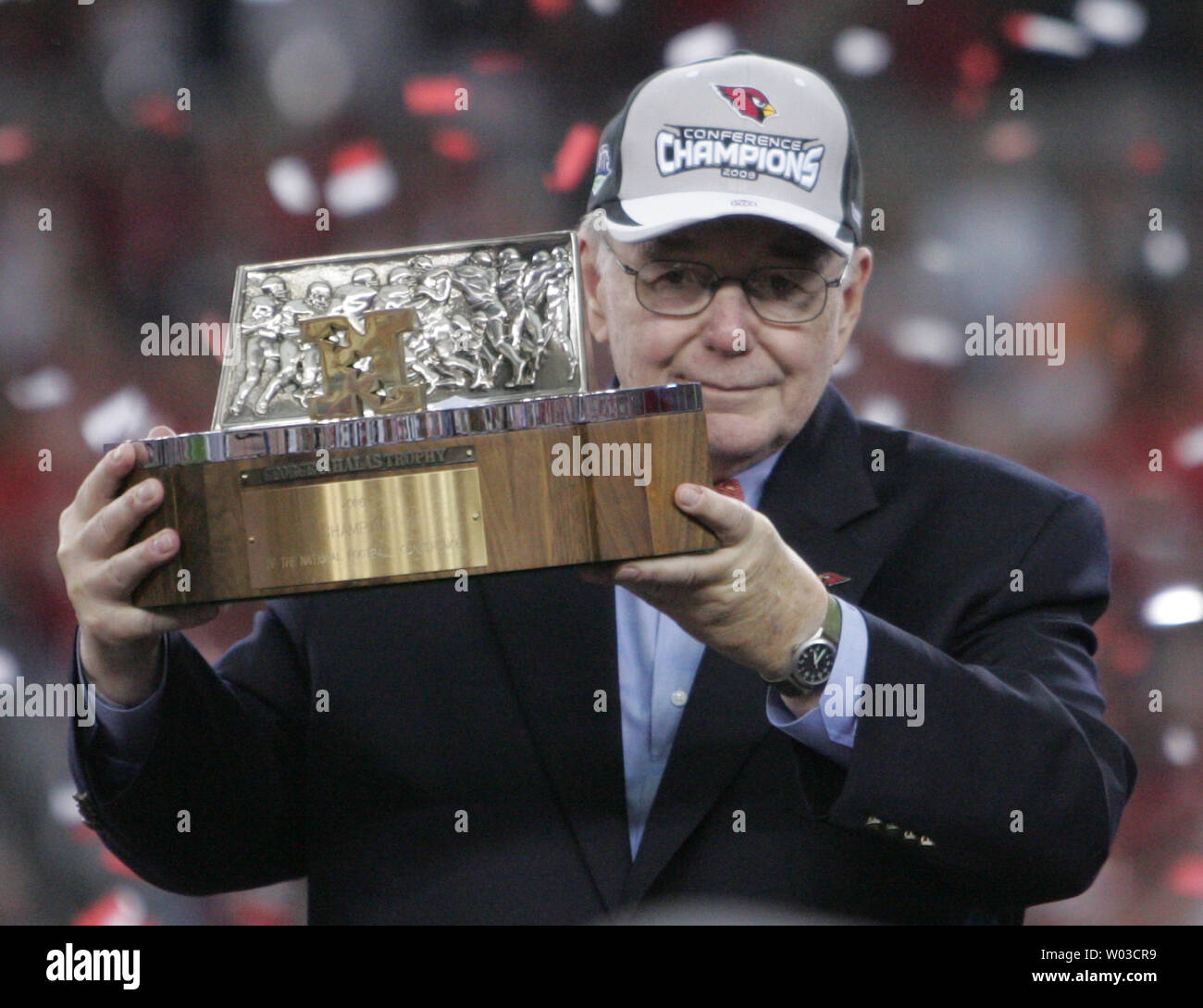 Arizona Cardinals owner William Bidwill hold the George Halas Trophy ...