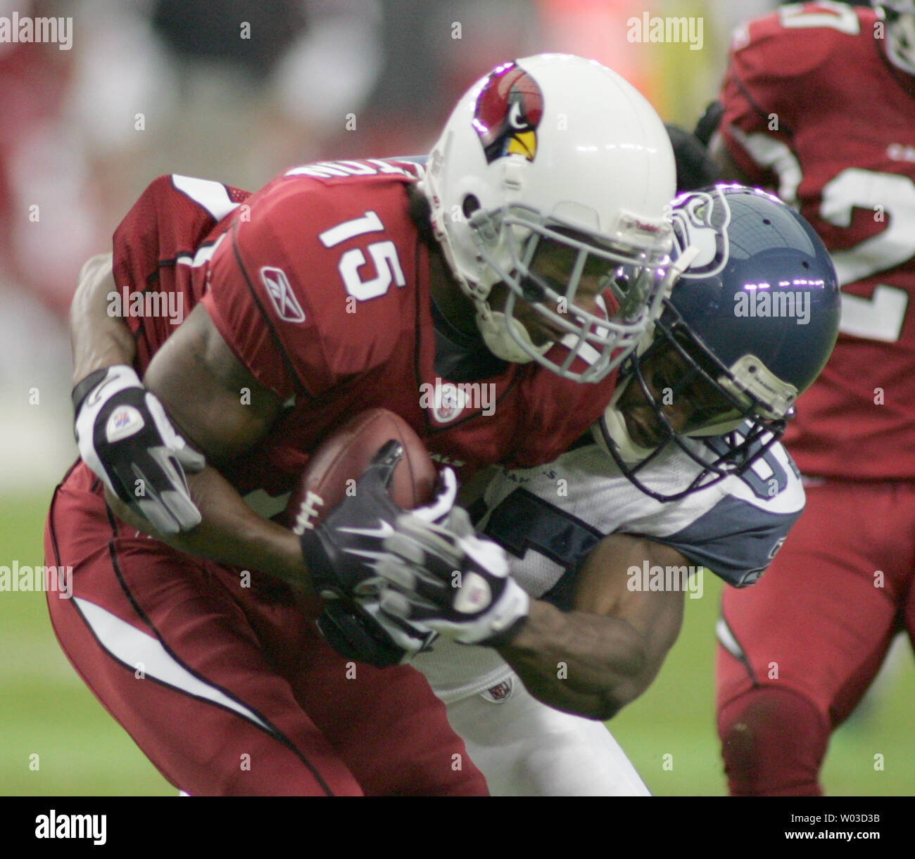 Arizona Cardinals return specialist Steve Breaston (L) is tackled for ...