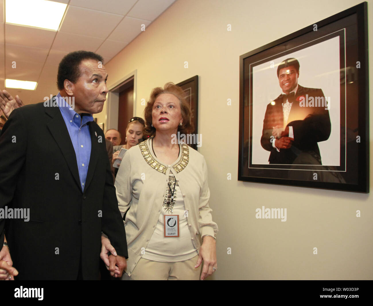 Mohammad Ali (L) and his wife Lonnie (R) take a tour of the new ...