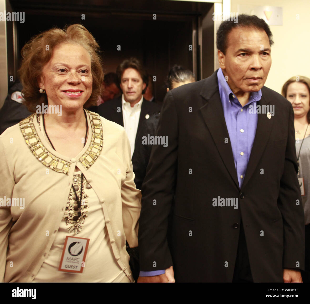 Mohammad Ali (R) and his wife Lonnie (L) enter the grand opening of the ...
