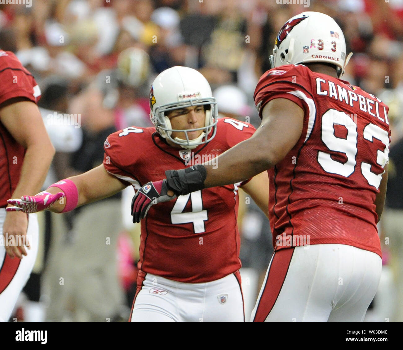 Arizona Cardinals kicker Jay Feely (L) gets congratulations from Calais ...