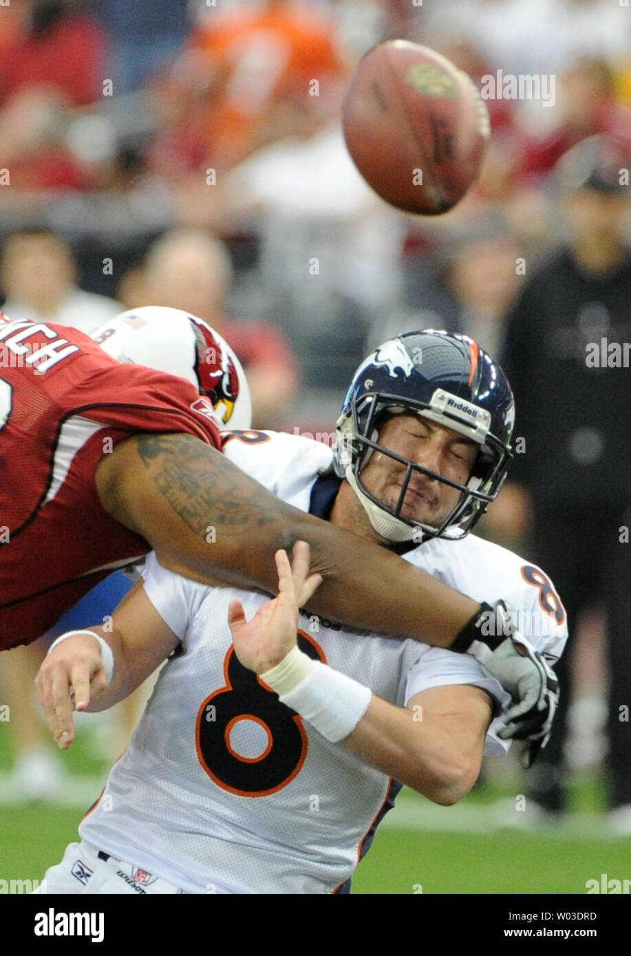 Denver Broncos quarterback Kyle Orton (R) is hit just after getting off ...