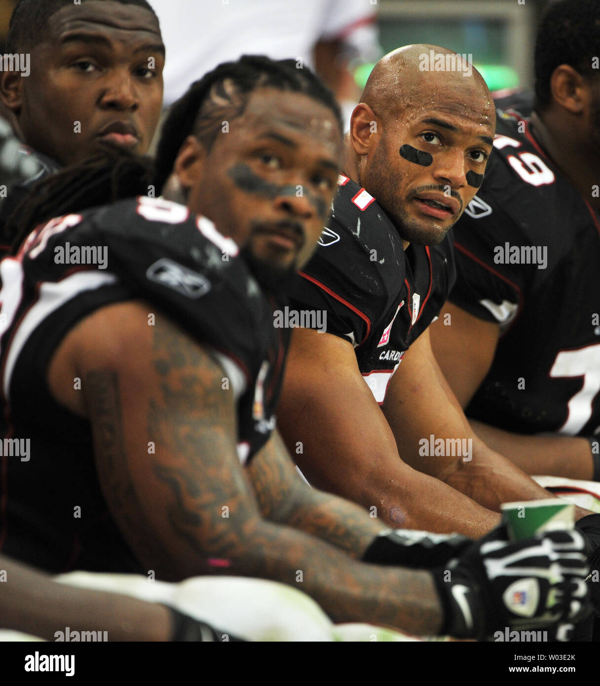 Arizona Cardinals Paris Lenon (R) watches the scoreboard with other ...