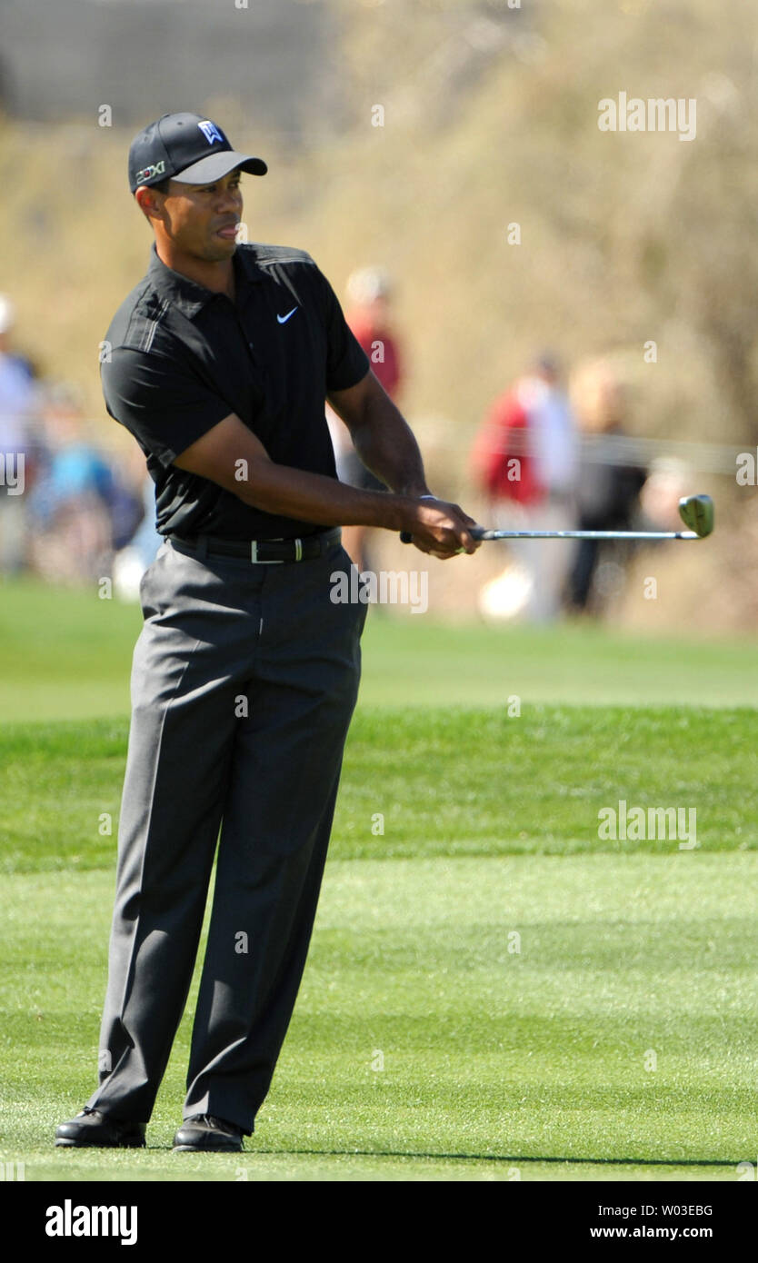 Tiger Woods follows his shot onto the nineth green at the WGC-Accenture ...