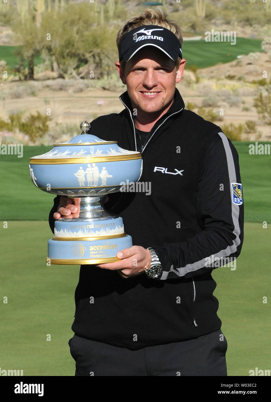 Luke Donald of England holds the trophy for winning the WGC-Accenture ...