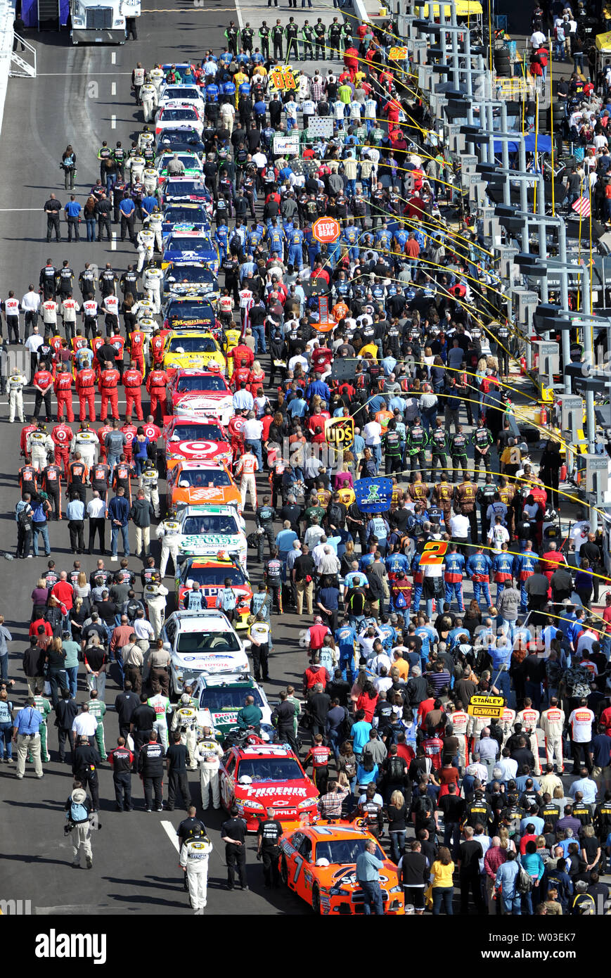 The crowd along pit row during the playing of the National Anthem ...