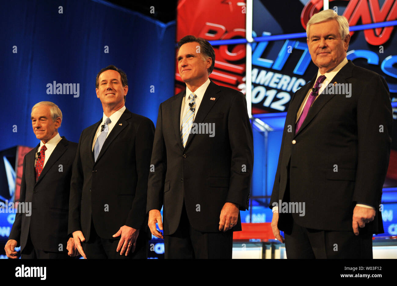 Ron Paul, Rick Santorum, Mitt Romney, and Newt Gingrich (L-R) stand on ...