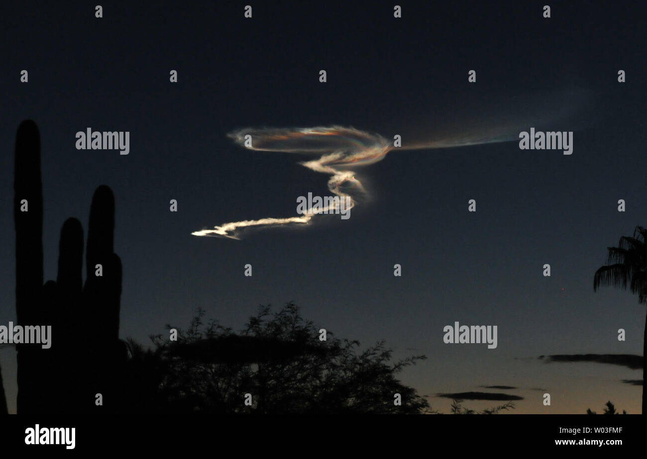 Rocket trails reflect the early morning light in the sky over Phoenix ...