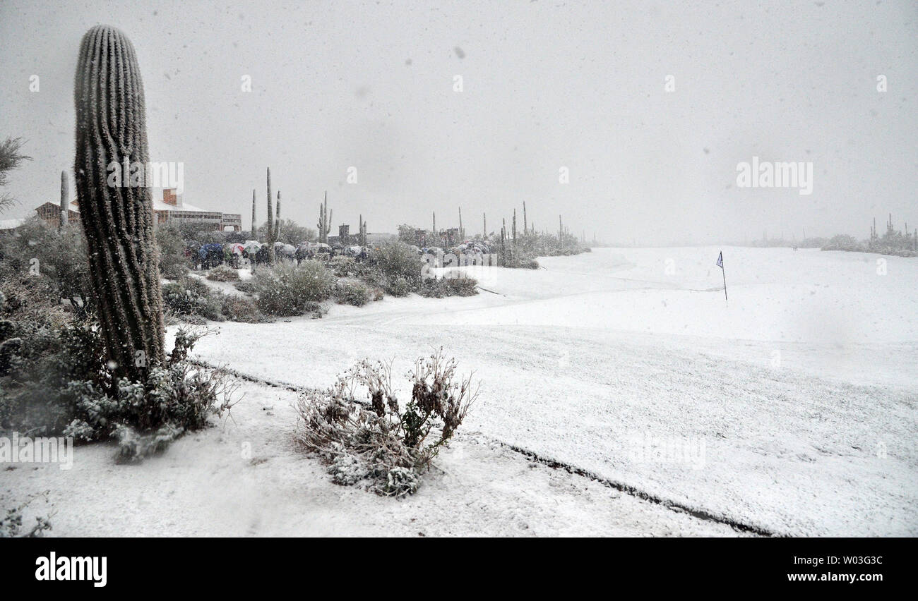 Snow covers the course after play was suspended during the first round ...
