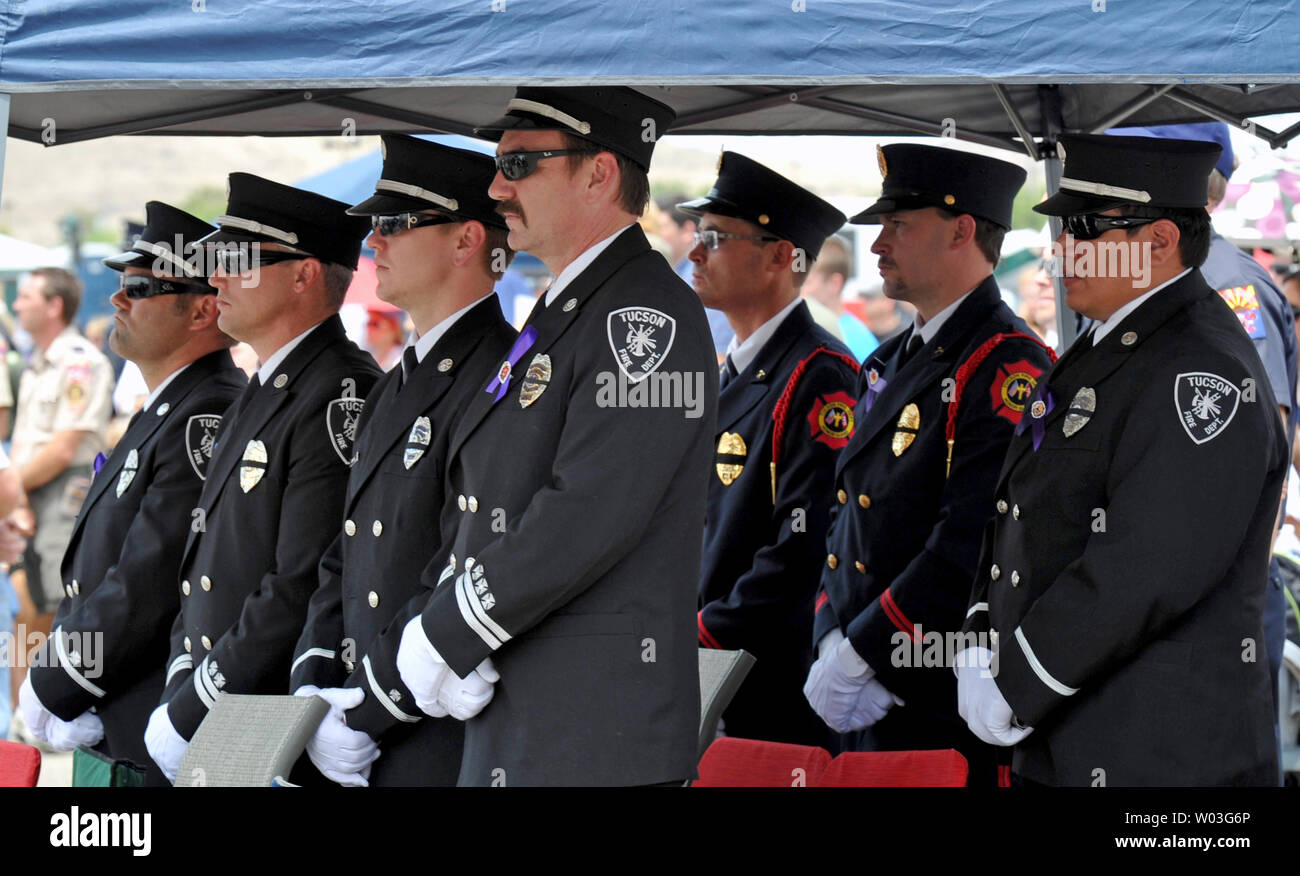Members of the Tucson Fire Department attend the funeral for the ...