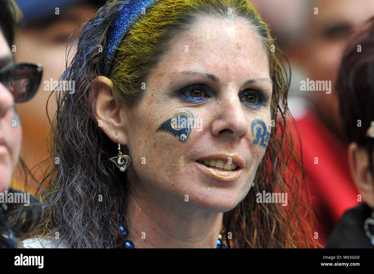 An St Louis Rams fan watches there action on the field during the first ...