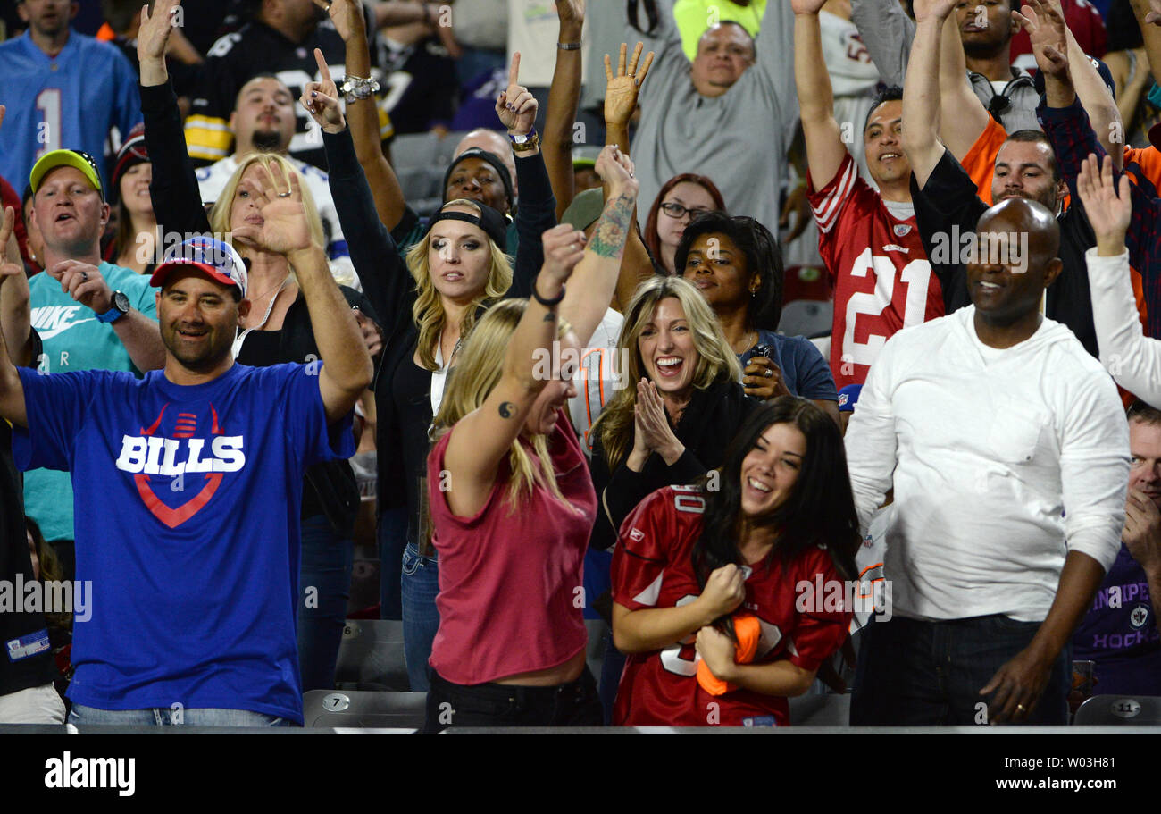 One fan (C) is happy for her friend who caught a t shirt at the NFL Pro ...