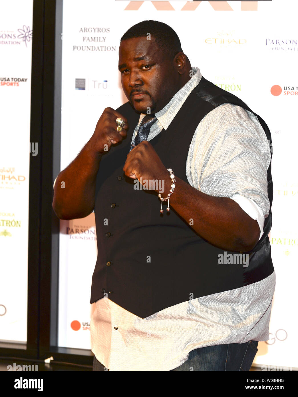 Actor Quinton Aaron takes a boxing pose as he arrives on the red carpet ...