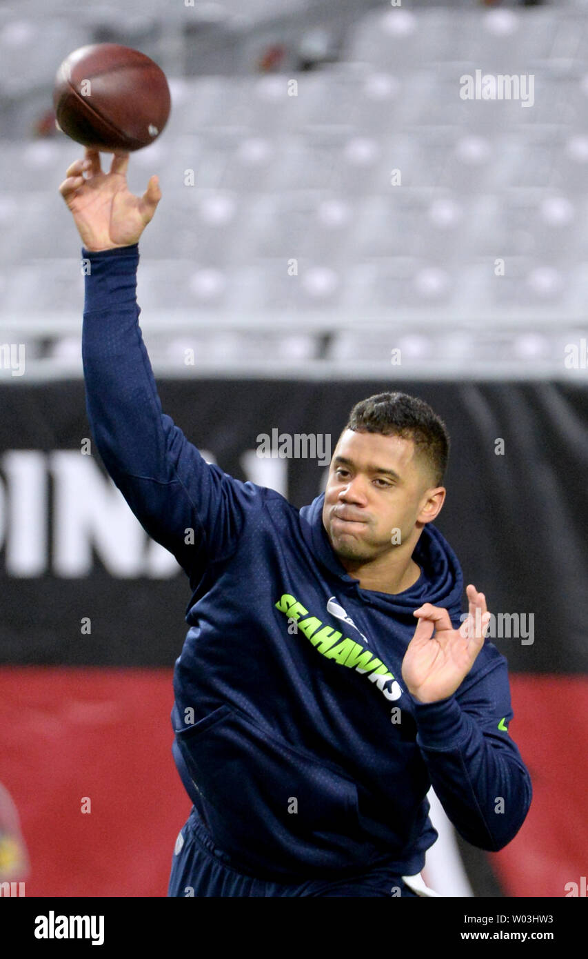 Seattle Seahawks quarterback Russell Wilson throws a pass as he warms ...