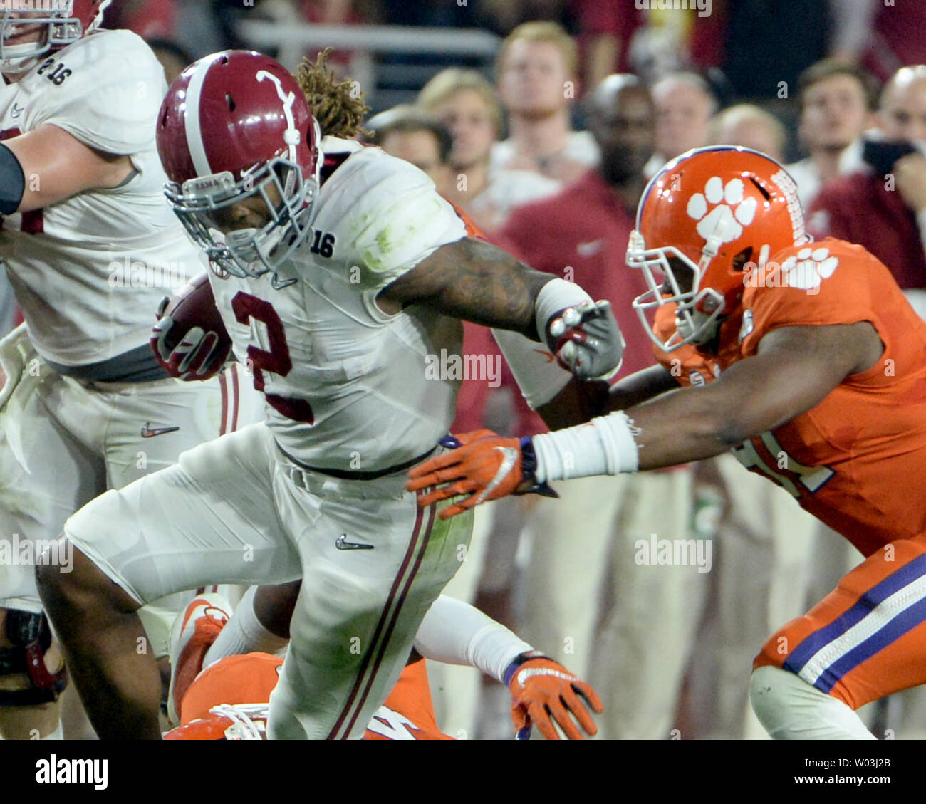 Stiff arm hi-res stock photography and images - Alamy