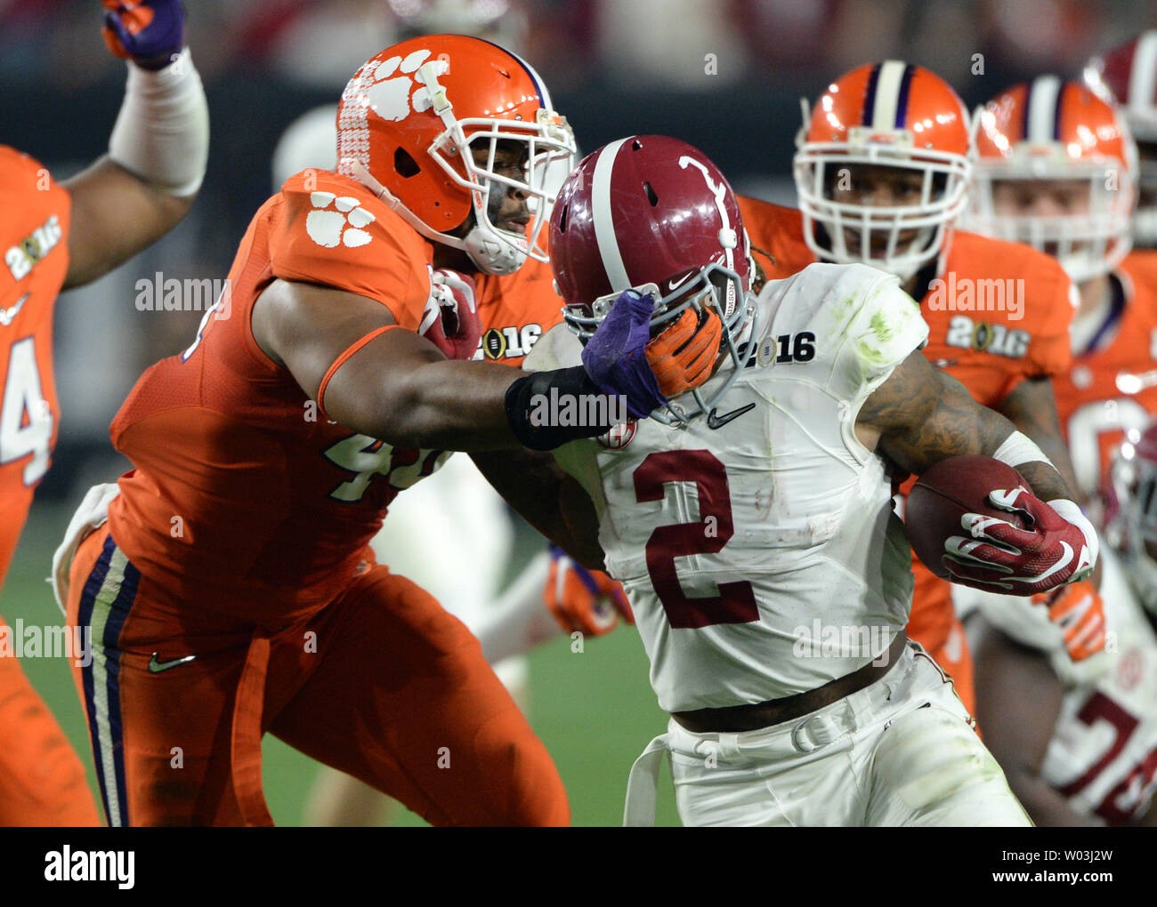 Alabama Crimson Tide running back Derrick Henry (2) has his face masked ...
