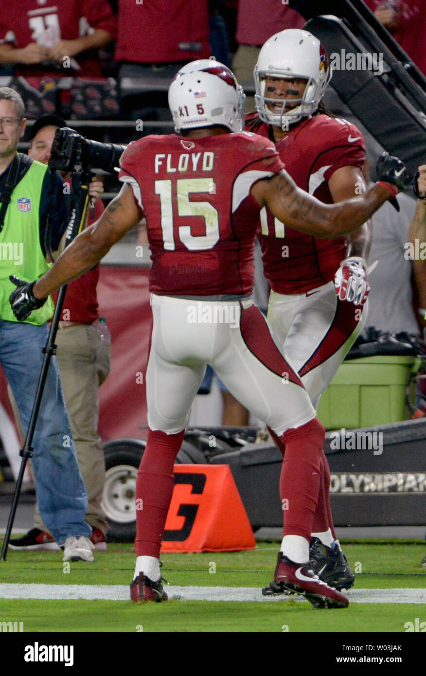 Arizona Cardinals' receiver Larry Fitzgerald (R) is congratulated by ...