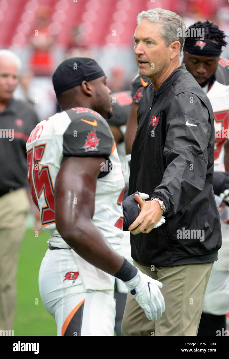 Tampa Bay Buccaneers' head coach Dirk Koetter (R) offers encouragement ...