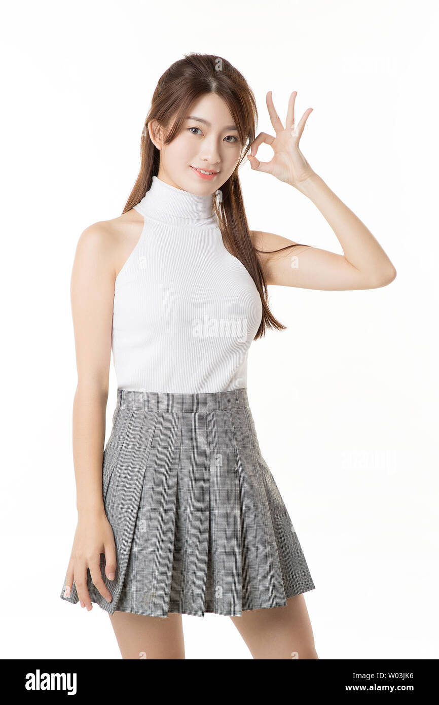 Beautiful cute college student against white background Stock Photo - Alamy