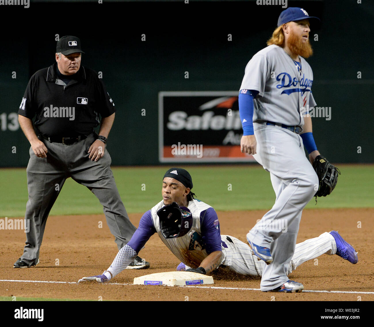 Arizona Diamondbacks Ketel Marte (C) gets hit in the mouth by his ...