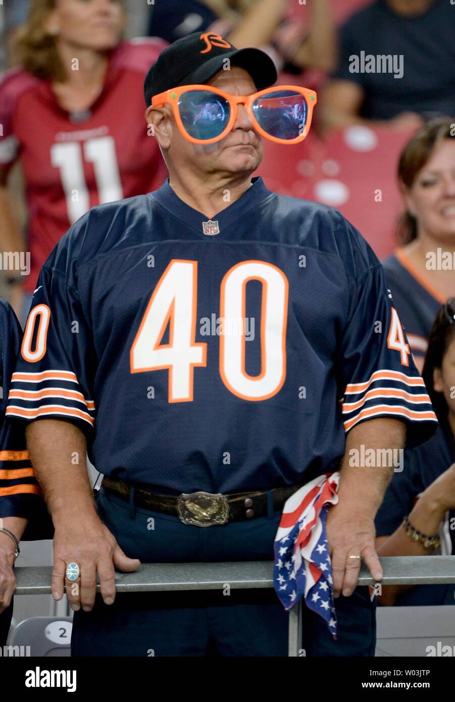 A Chicago Bears' fan watches the Bears warm up before the start of the ...
