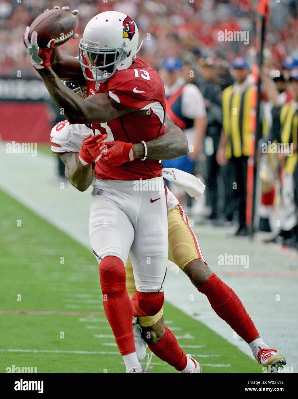 Arizona Cardinals' receiver Jaron Brown picks up a first down after ...