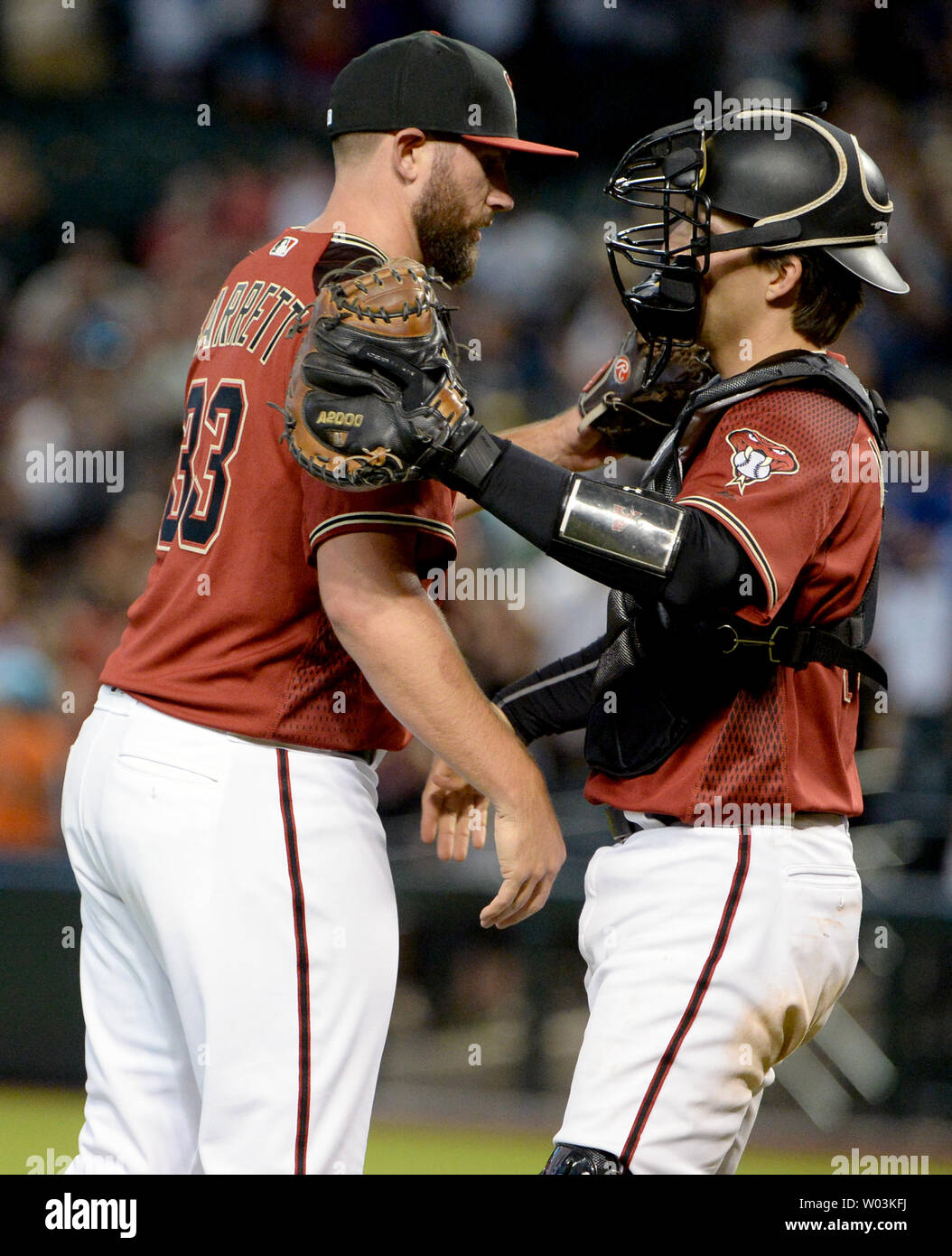 Arizona Diamondbacks' pitcher Jake Barrett (L) and catcher John Ryan ...