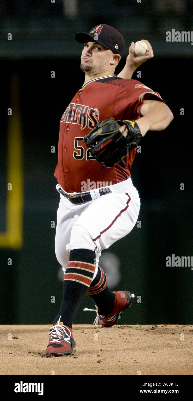 Arizona Diamondbacks' starting pitcher Zack Godley delivers a pitch in ...