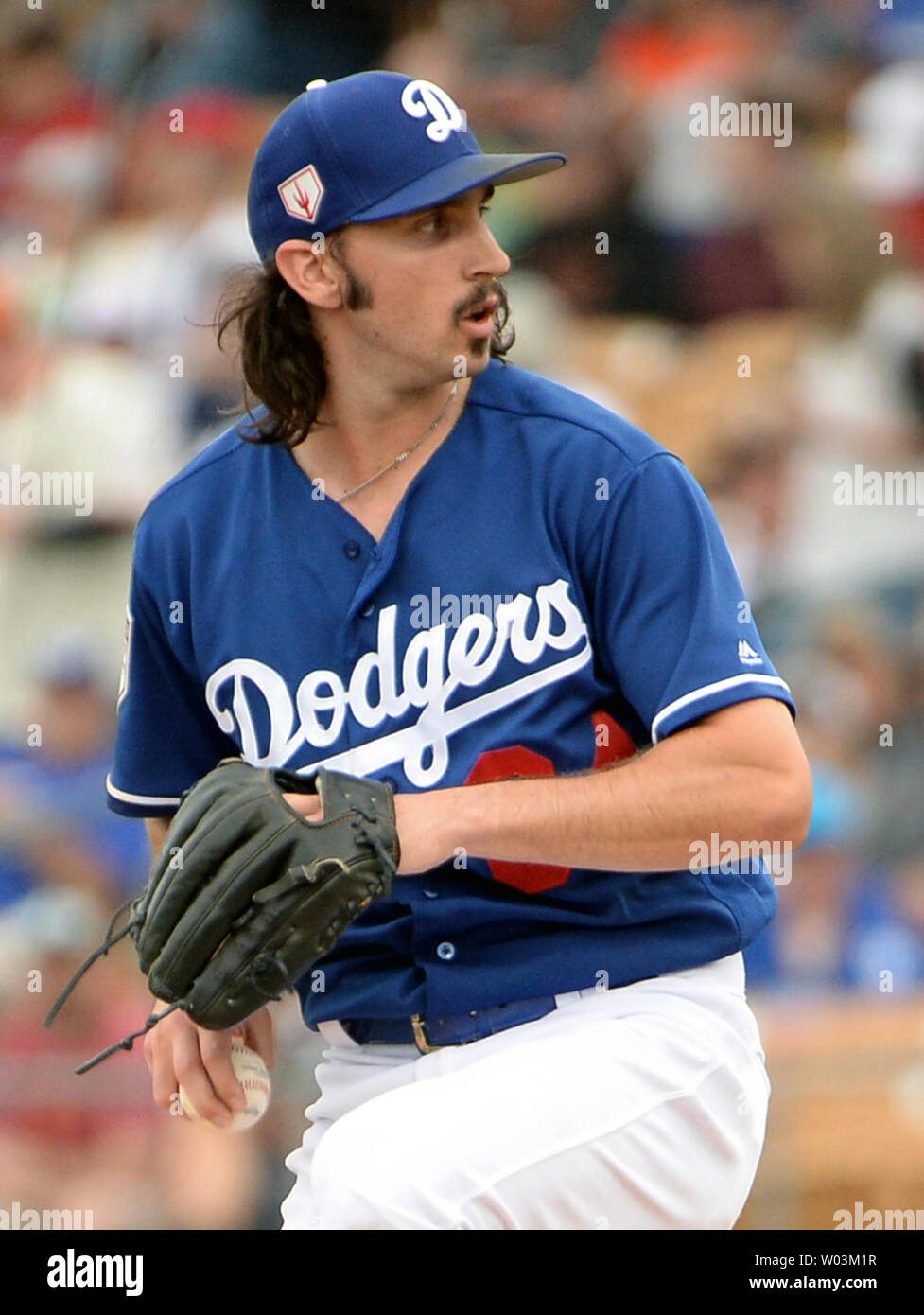 Los Angeles Dodgers' pitcher Tony Gonsolin starts his delivery against ...